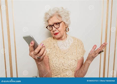 Confused Senior Woman Using Mobile Phone Stock Image Image Of