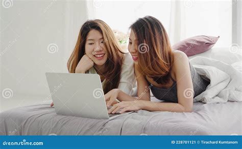 Beautiful Young Asian Women Lgbt Lesbian Happy Couple Sitting On Bed