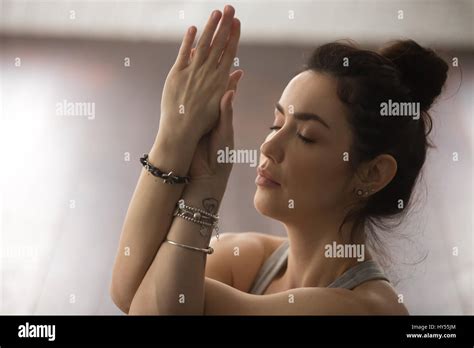 Portrait Of Young Attractive Woman Meditating With Closed Eyes Stock