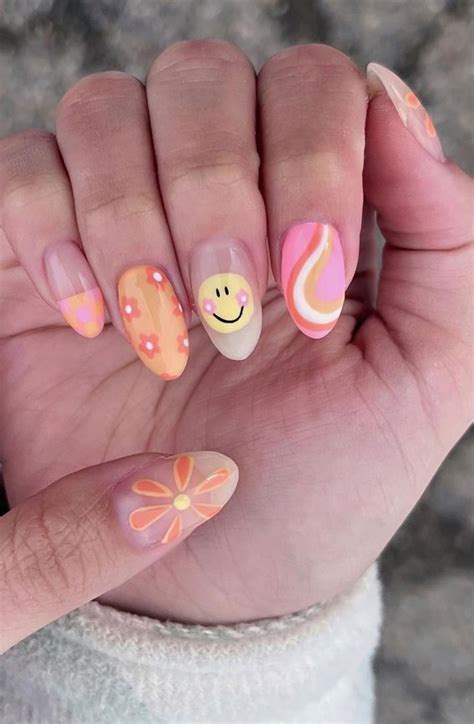 50 Cute Summer Nails For 2023 Orange Abstract Tips With Flower Accents