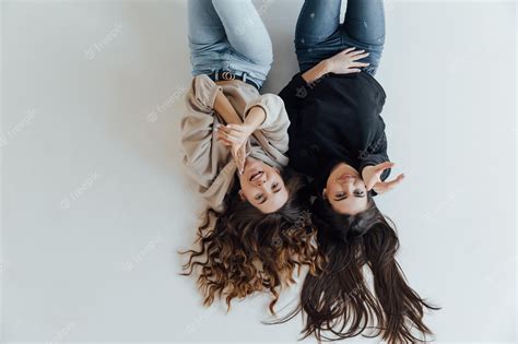 Premium Photo Cheerful Lesbians Embrace Passioantely And Have Fun