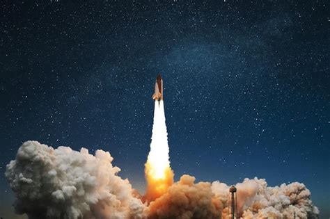 Premium Photo Space Rocket With Clouds Of Smoke And Blast