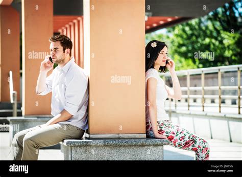 Couple Having Problems Two People Sitting On Opposite Side Of Big