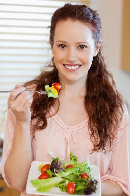 Premium Photo Girl Eating Salad