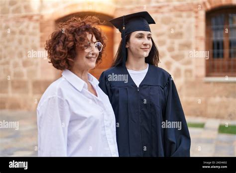Two Women Mother And Daughter Celebrating Graduation At Campus