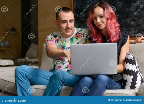 Portrait Of Couple Using Laptop Together At Home Stock Image Image Of