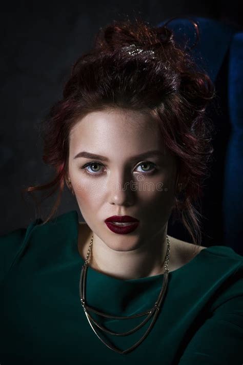 Young Beautiful Red Haired Caucasian Woman With Professional Makeup In