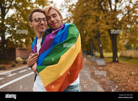 Romantic Gay Couple Hugging Kissing And Holding Hands Outdoors Two