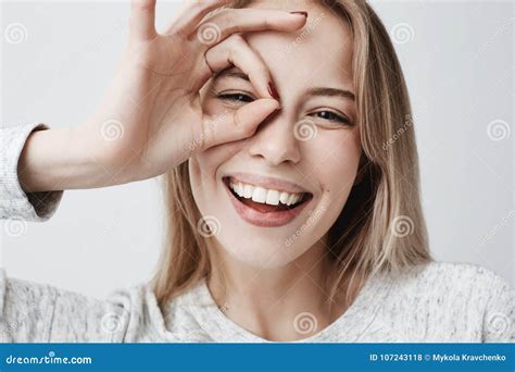 Close Up Portrait Of Beautiful Joyful Blonde Caucasian Female Smiling