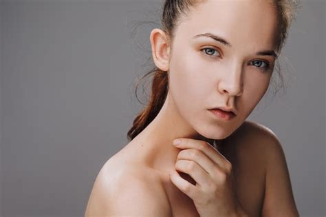 Premium Photo Portrait Of Shirtless Woman Against Gray Background