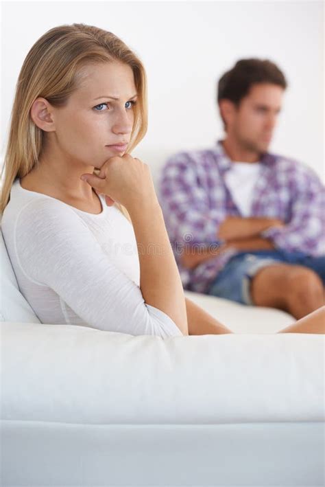 Giving Him The Silent Treatment An Upset Woman Sitting In A Couch With