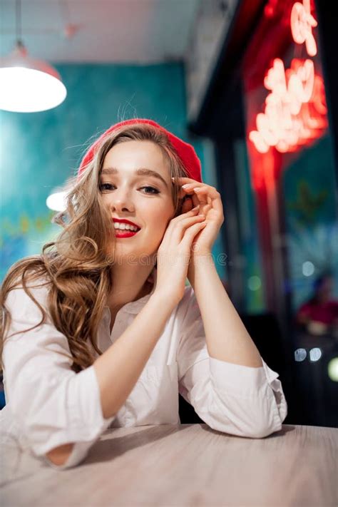 Young Pretty France Woman In Red Beret Is Waiting For Order Food Coffee
