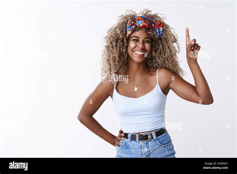 Cheerful Enthusiastic Curly Haired African American Blond Woman With