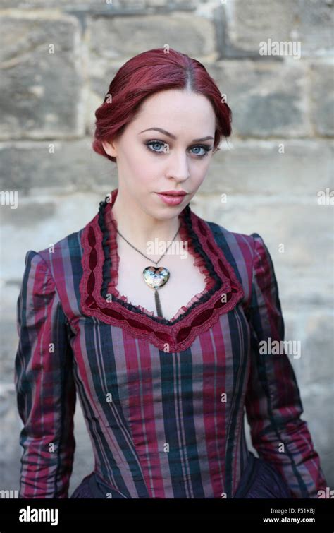 Portrait Of A Beautiful Red Haired Girl Wearing Gothic Inspired