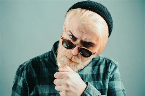 Premium Photo Mature Blonde Bearded Guy With Trendy Hairdo In Casual