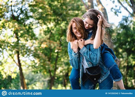 Beautiful Women Having Fun In The Park Friends And Summer Concept