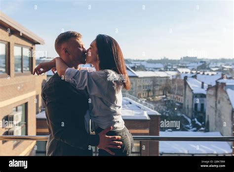 Loving Beautiful Young Couple Man And Woman Standing On The Balcony On