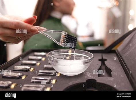 Hairdresser Applies A Hair Mask To The Woman In The Beauty Salon Botox