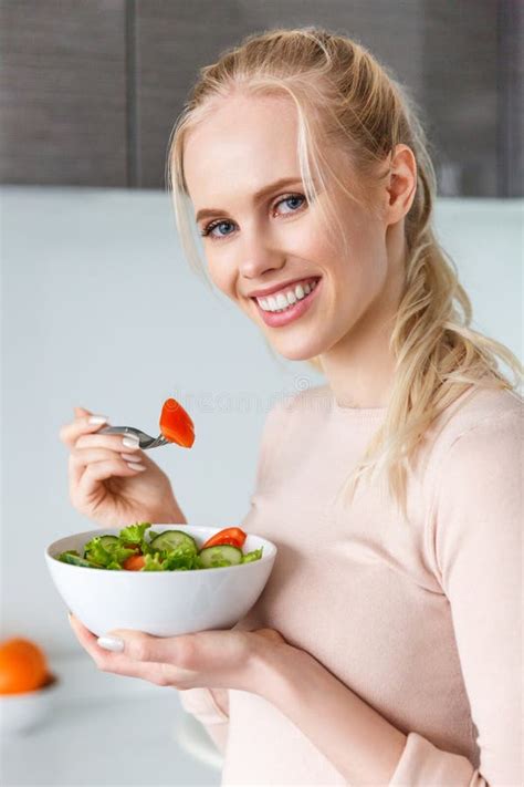 Beautiful Young Blonde Woman Eating Fresh Healthy Vegetable Salad And