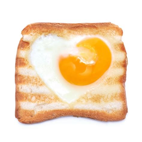 Premium Photo Heart Shaped Fried Eggs In A Toasted Bread With Grill