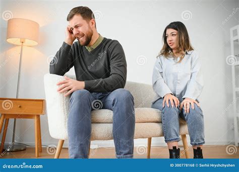 Couple Arguing Wife Shouting To Her Desperate Husband Sitting On A