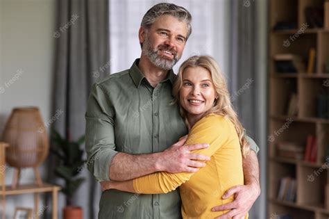 Premium Photo Portrait Of Happy Married Middle Aged Couple Hugging At