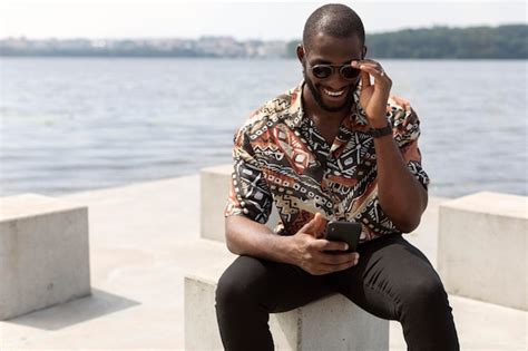 Free Photo Handsome Man Using Modern Smartphone Outdoors