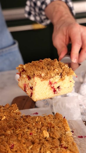 This delicious Cranberry Crumb Cake is the perfect balance of zingy cranberries with a crunchy almond brown sugar streusel and moist, melt-in-your-mouth cake. Kissed with vanilla and almond extract, it’s a lovely cake to help warm your winter mornings. Recipe up on my Substack! #preppykitchen #baker #recipevideo | Preppy Kitchen