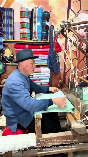 Traditional Weaving: Man Creates Fabric on a Hand Loom