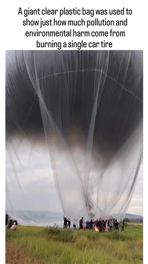 snapt.rendz on Instagram: "The video depicts a 2026 environmental awareness stunt where activists enclosed a burning car tire in a massive transparent plastic bag, filling it with over 10,000 liters of thick black smoke to visualize the pollution volume from one tire. Burning a single tire releases up to 2.5 kg of particulate matter, including carcinogenic PAHs and heavy metals like zinc and cadmium, per EPA-linked studies, contributing to respiratory diseases and ecosystem damage far beyond the