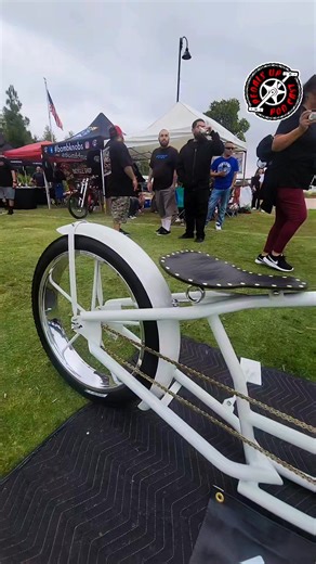 5.4K views · 193 reactions |  PURE WHITE CHOPPER PERFECTION  This pure-white killer custom chopper is crazy clean! The lines flow smooth, the one-off wheels are insane, and that tank detail sets the whole build off. Another masterpiece from Chop Huey Customs. No motor needed. Spotted shining bright at The SoCal Bike Show ✨ #pedalsupshow #pedalsuppodcast #custombike #bikelife #CruiserBikes #bikeculture #bicyclecustomization | Pedals Up Podcast | Facebook