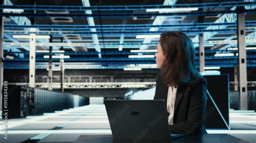 Typing on keyboard, laptop and engineer in data center troubleshooting supercomputers connectivity issues. Fixing gear errors, notebook program and expert in server hub analyzing system logs, camera A