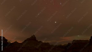 4K time lapse video of the Aurora Borealis on 10-10-24 above the South Guardian Angel peak from the Grapevine trail in Zion Nat. Park Utah, USA with high thin clouds moving through.