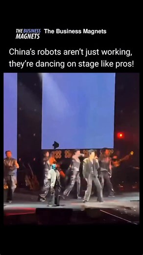 The Business Magnets on Instagram: "At Wang Leehom’s Best Place Tour concert in Chengdu, six Unitree G1 humanoid robots joined the show as synchronized backup dancers. Dressed in baggy pants and shiny stage outfits, they moved in perfect time with the music during the performance of Open Fire. The highlight was all six robots nailing Webster flips, a front flip with a half twist, in near perfect unison on stage, electrifying the crowd and quickly going viral online. The performance blended advan