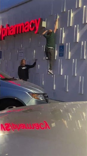 Bro Climbs The CVS Sign