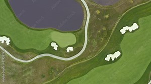 Aerial golf club. Golf course from the height of a bird's flight. Drone flying over the golf course. View of the golf course from above.