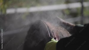 Man cleaning fermentation tanks for making different types of homemade brandy, slow motion