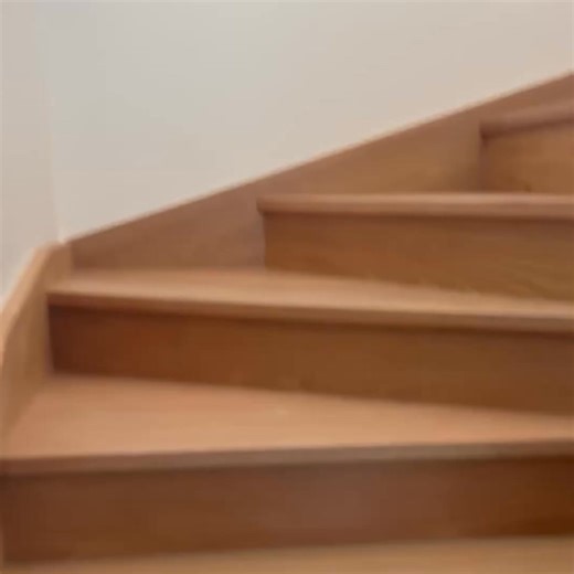 Loving how the timber staircase draws your eye straight to that raffia feature light. Simple details, big impact | Oliver Burrows Construction