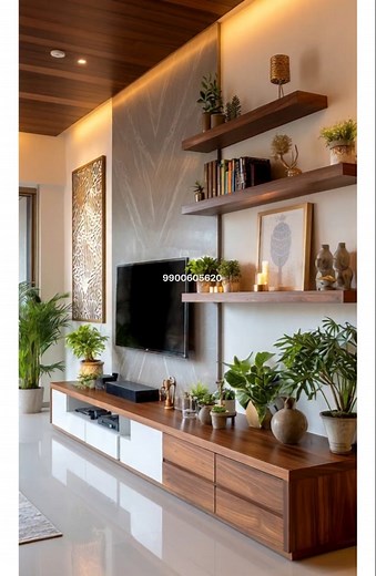 Dreaming of a stylish and functional TV wall? 🤩 Get inspired by this beautiful setup featuring a sleek floating cabinet, elegant back panel, and smart storage solutions. It's all about the details! 💡 #HomeDesign #TVCabinet #InteriorStyling #DecorIdeas #LuxuryInteriors #ReelItFeelIt | Home Interiors