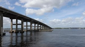 Landscape of the Edison bridge going over the Caloosahatchee River this bridge connects Cape Coral to Fort Myers Florida shot from centennial park peir