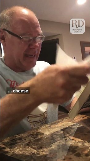 Man Laughs Hysterically While Trying to Read Joke Book