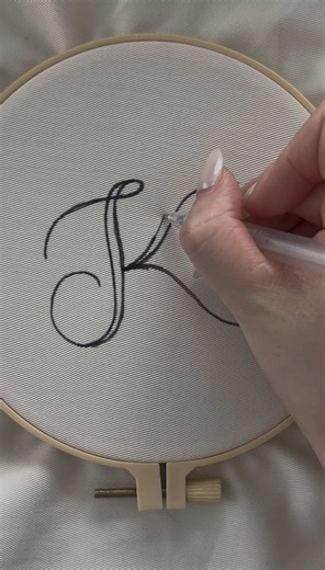 Katie, Kayla, Kristen—where are you at? 👋 The calligraphy series continues with Letter K! 🖊️ They say K is the hardest letter to write in cursive, but watch this flow. ☁️ Who is next? 👇 #letterK #embroidery #satisfying #sketching #calligraphy