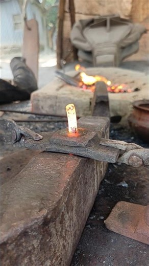 Watch how a blacksmith makes nails from old iron."
