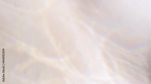 Water rays of light reflections shadow overlay effect through glass on a white background with rainbow reflection. Abstract blurred crystal glasses light.