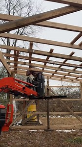 The implement barn finally gets a roof! Now we can start storing things under cover until we get going on the sawmill for wall lumber. #kubota #sawmill #polebarn #tractor #storage #livingouramericandream | Living Our American Dream
