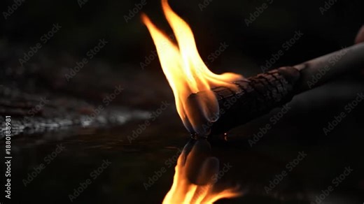 Burning Torch Reflection in Water - Symbolism of Light, Hope, and Illumination