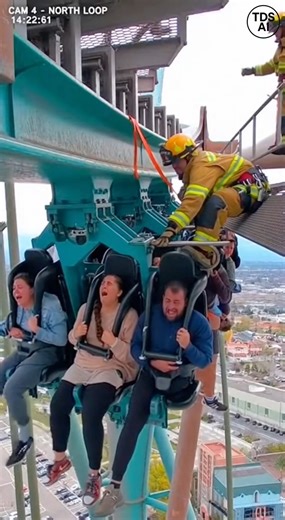 Security camera captures roller coaster stalled at peak as crews work to restore ride Sandusky, Ohio — Security camera footage from a popular amusement park in Sandusky shows a roller coaster train stalled at the top of its highest incline while maintenance crews work to resolve the issue. The video reveals the coaster cars paused just before the first major drop, with riders seated and secured as park staff respond below. Several employees can be seen accessing the lift structure while communic