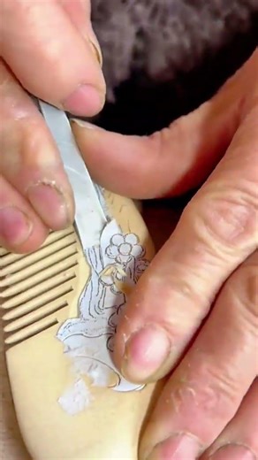 Carving delicate floral patterns into wood using a sharp chisel with slow controlled hand motions