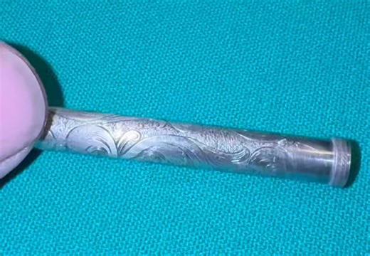 First bamboo fly rod ferrule engraved on the new fixture I built. Far from perfect as it was from the junk box in my fly rod shop, but engraving it helped me determine the best graver geometry to use doing these. | Bob Nunley, Hand Engraving