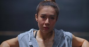 clip-1093053133-portrait-young-beautiful-tired-sweaty-woman-boxer